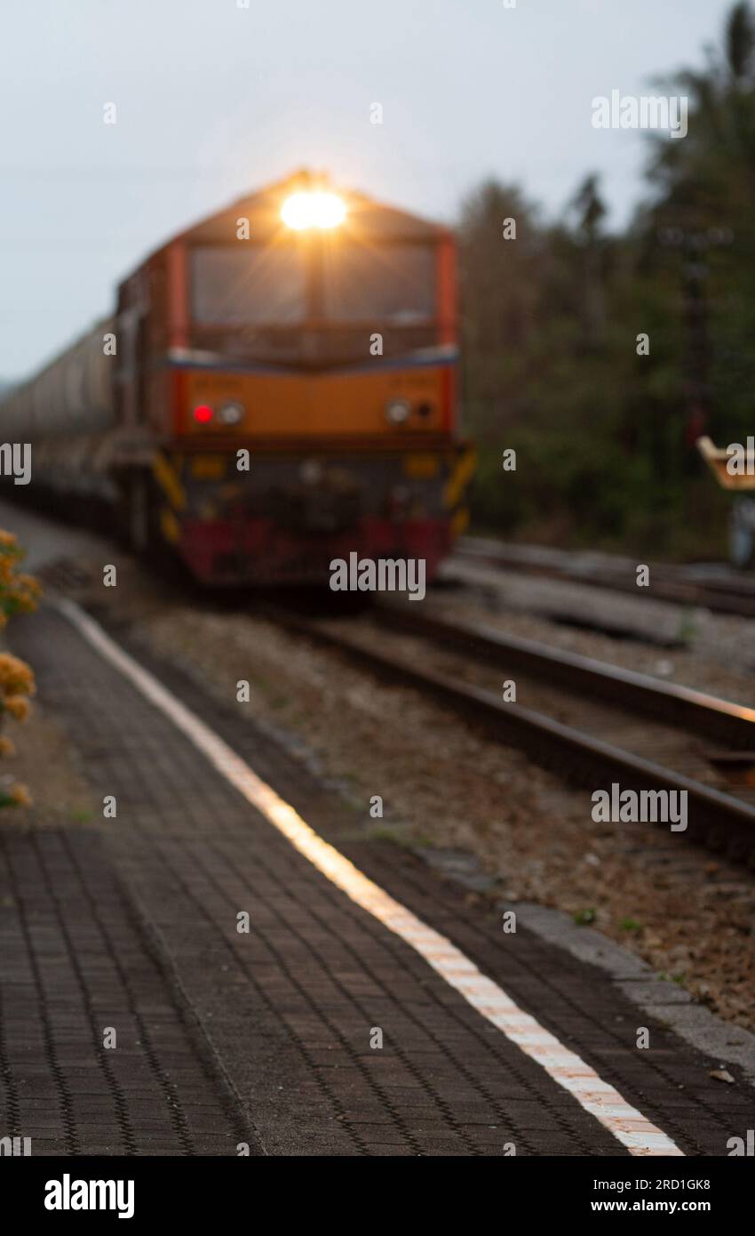 Train running on train tracks blurry background Railway track on rural ...