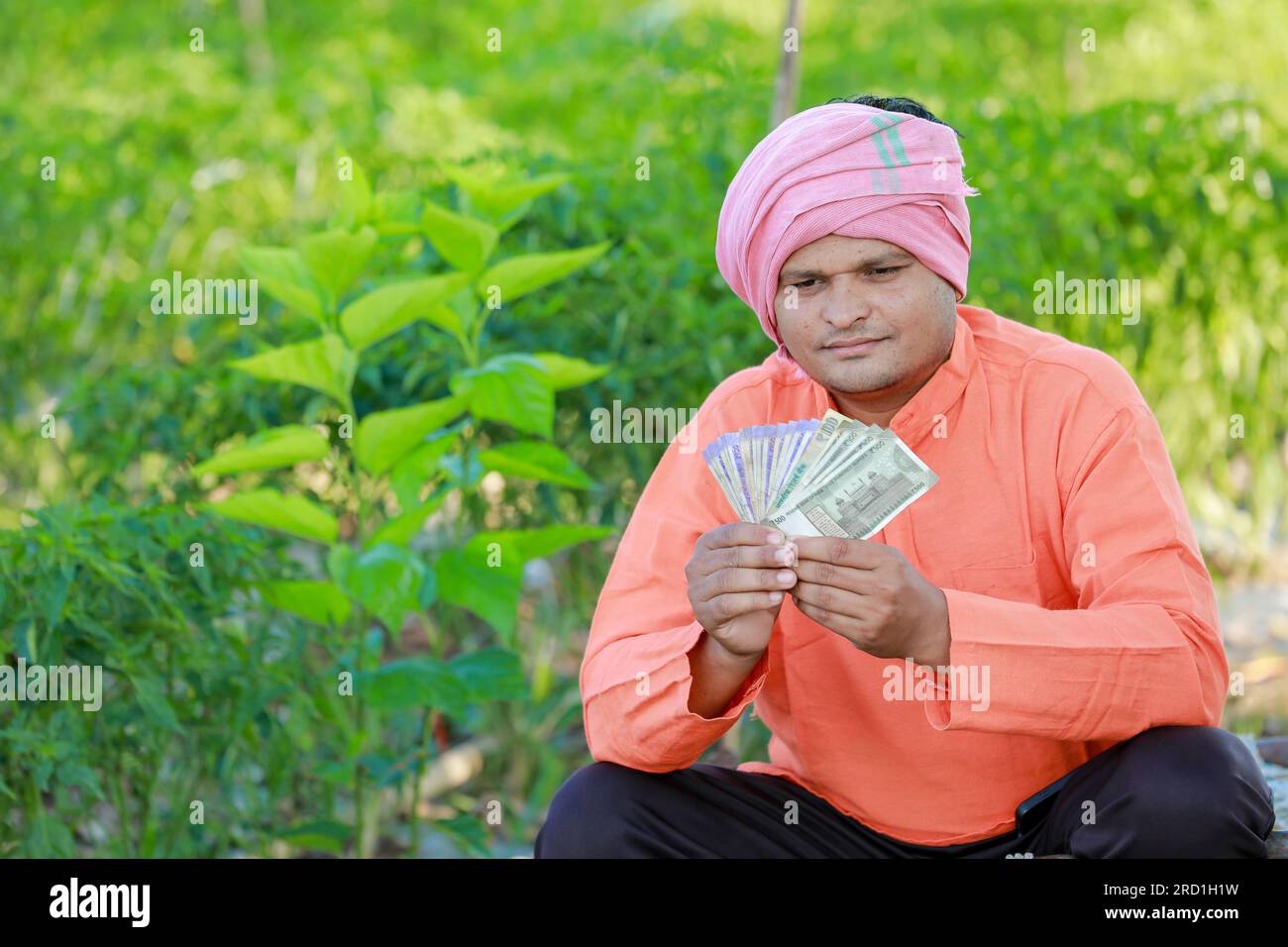 Happy Indian farmer, farmer holding indian rupees in hands, smart ...