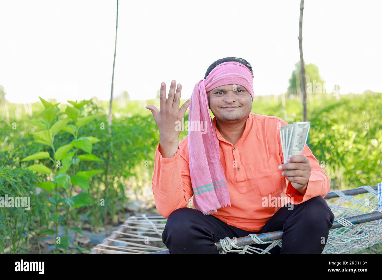 Happy Indian farmer, farmer holding indian rupees in hands, smart ...