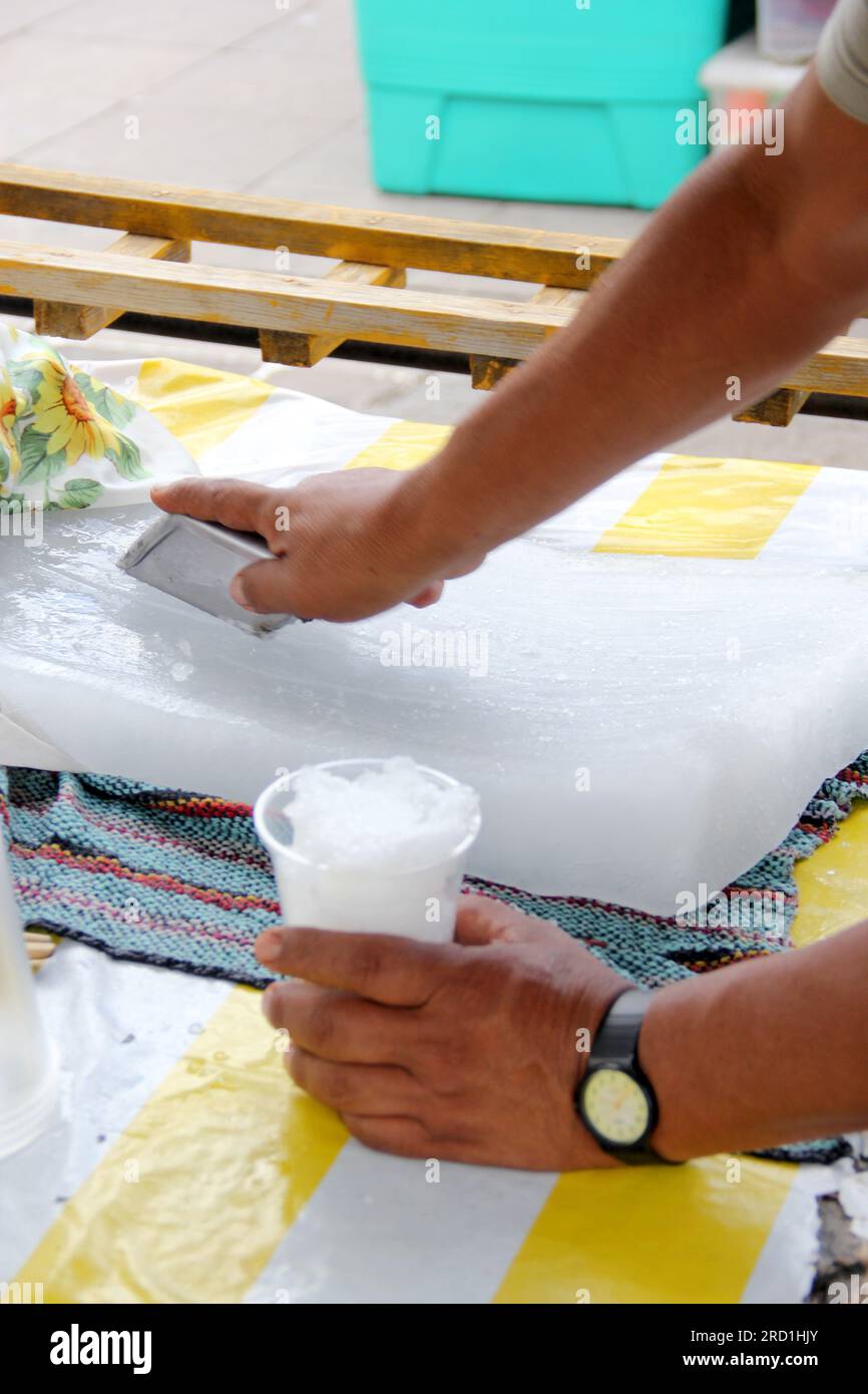 Street vendor of granita or shaved ice, is a soft drink or snack made ...