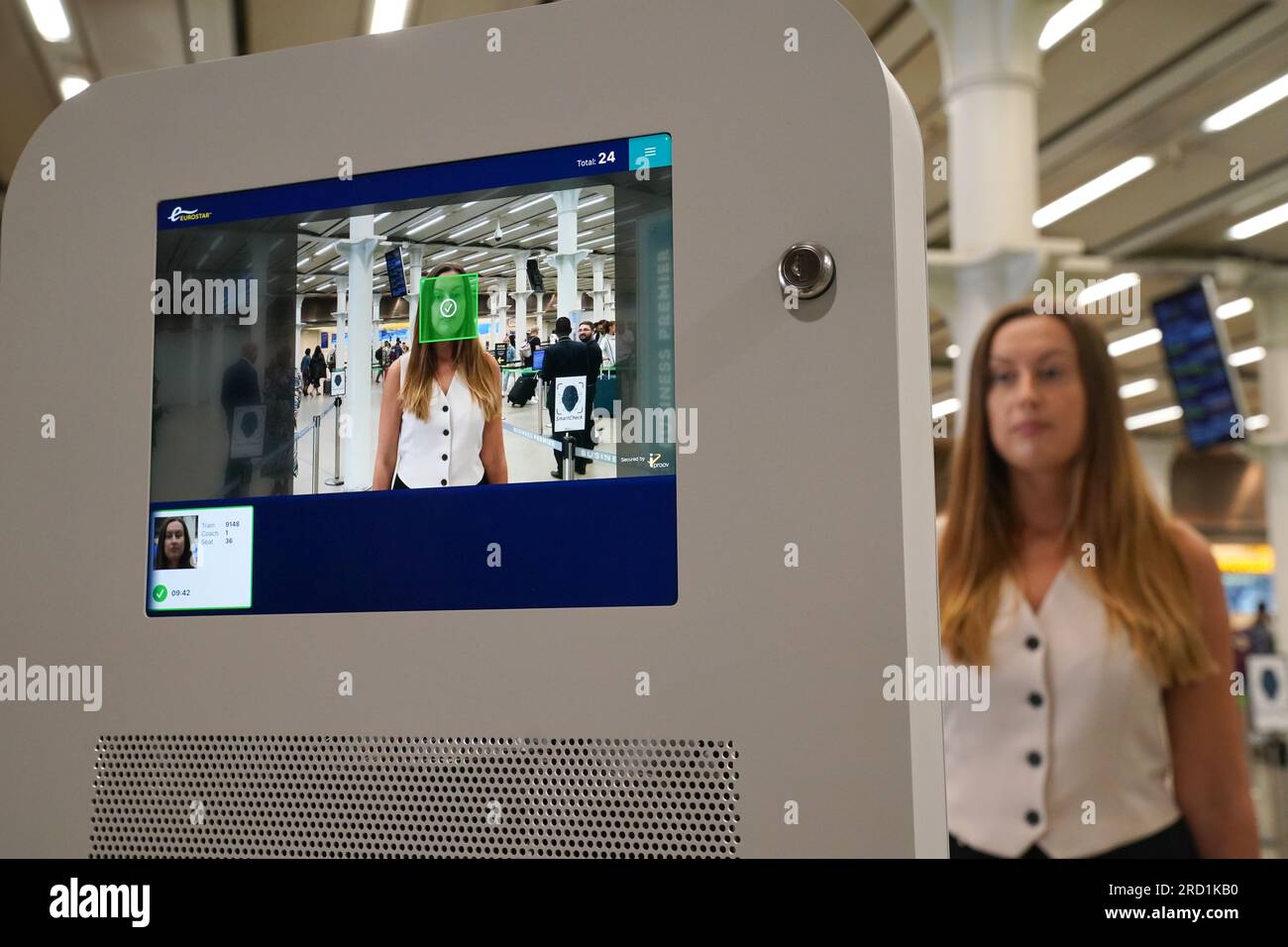 Staff demonstrate the new SmartCheck facial biometric check-in system ...