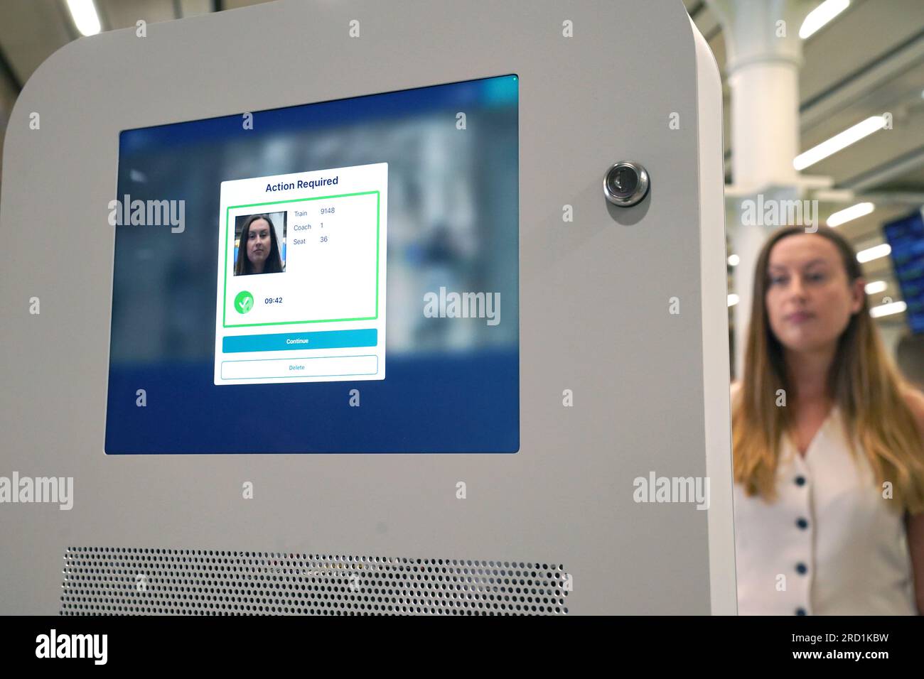 Staff demonstrate the new SmartCheck facial biometric check-in system ...