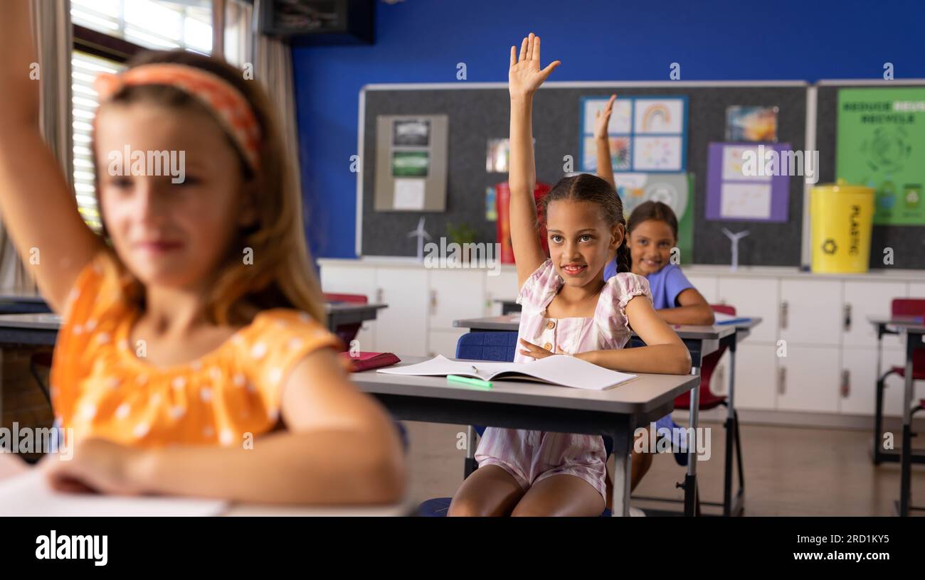 Children raising hands in class hi-res stock photography and images - Alamy