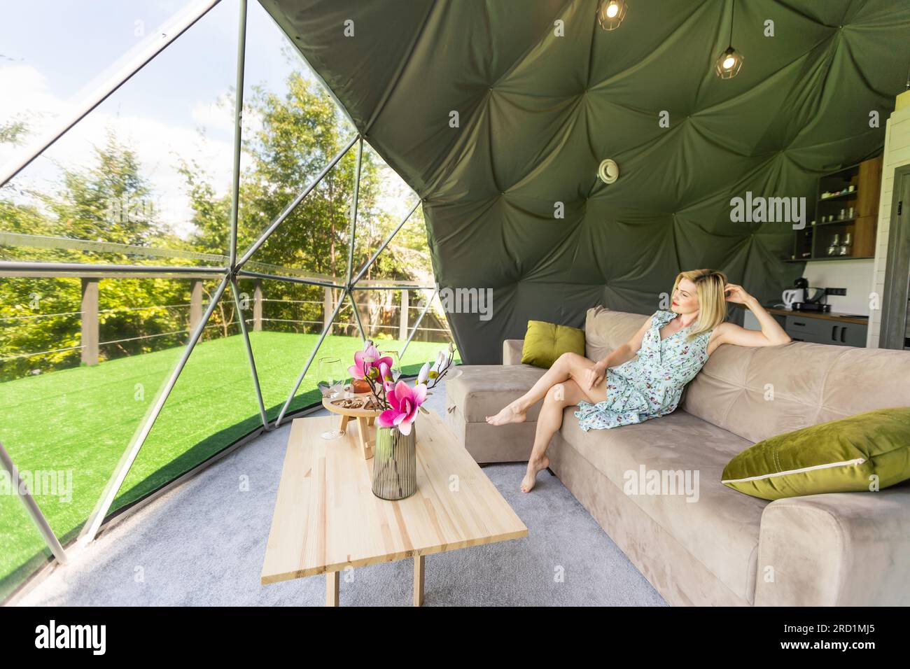 a woman enjoys solitude inside of a transparent bubble hotel Stock ...