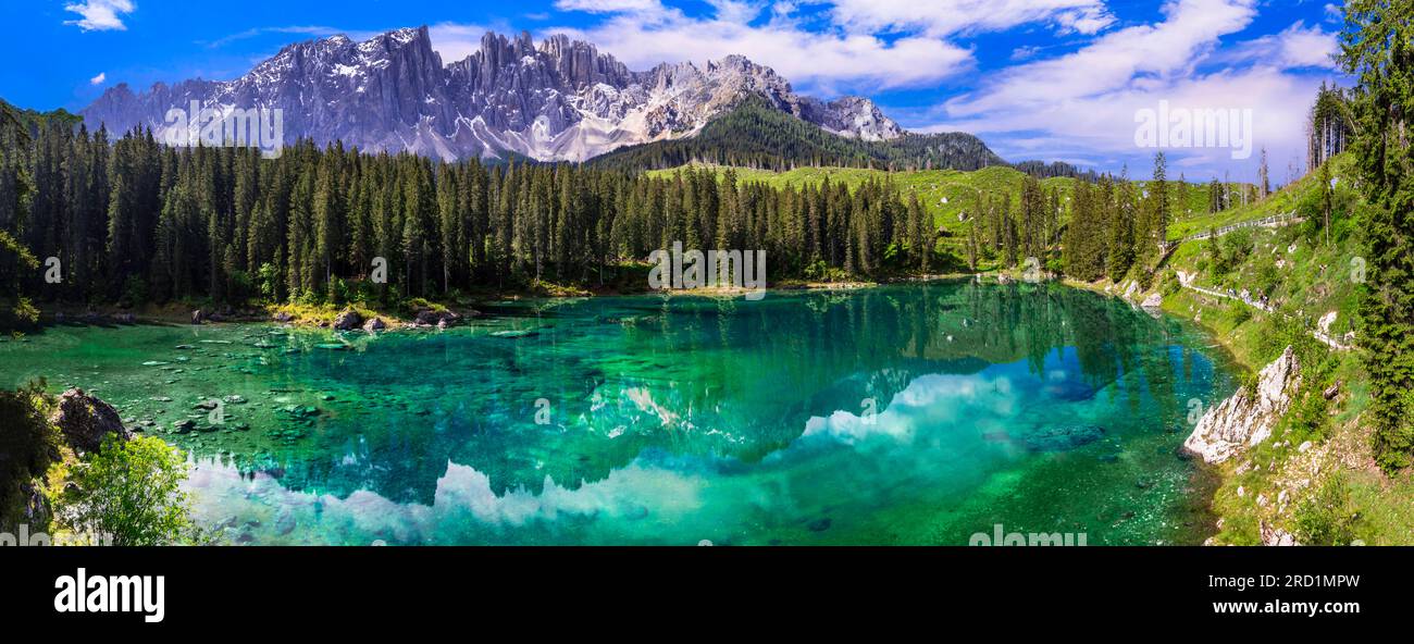 Idyllic nature scenery- turquoise mountain lake Carezza surrounded by ...