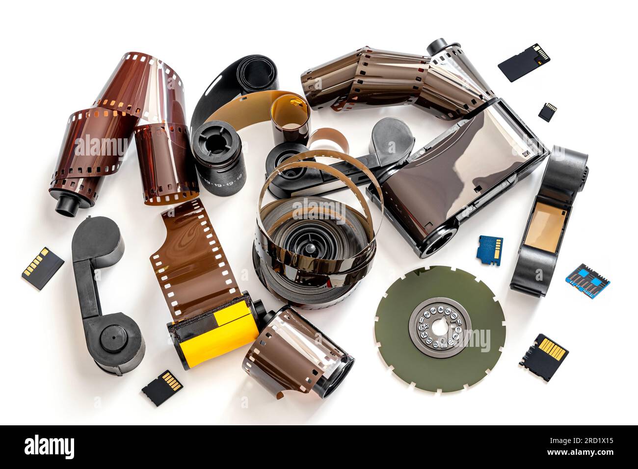 a collection of old photo films and memory card on white background ...