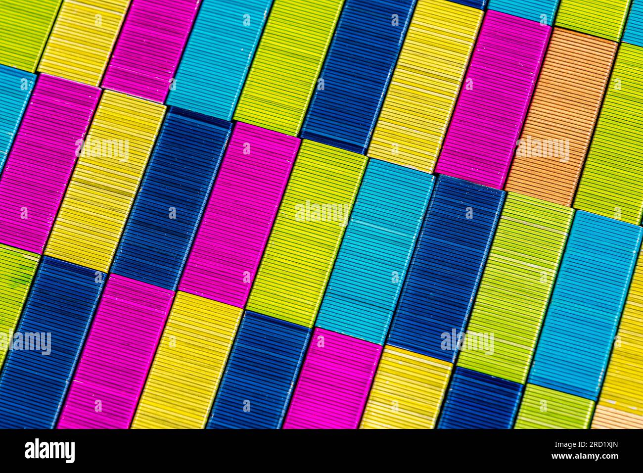 Multicolored office metal staples background Stock Photo - Alamy