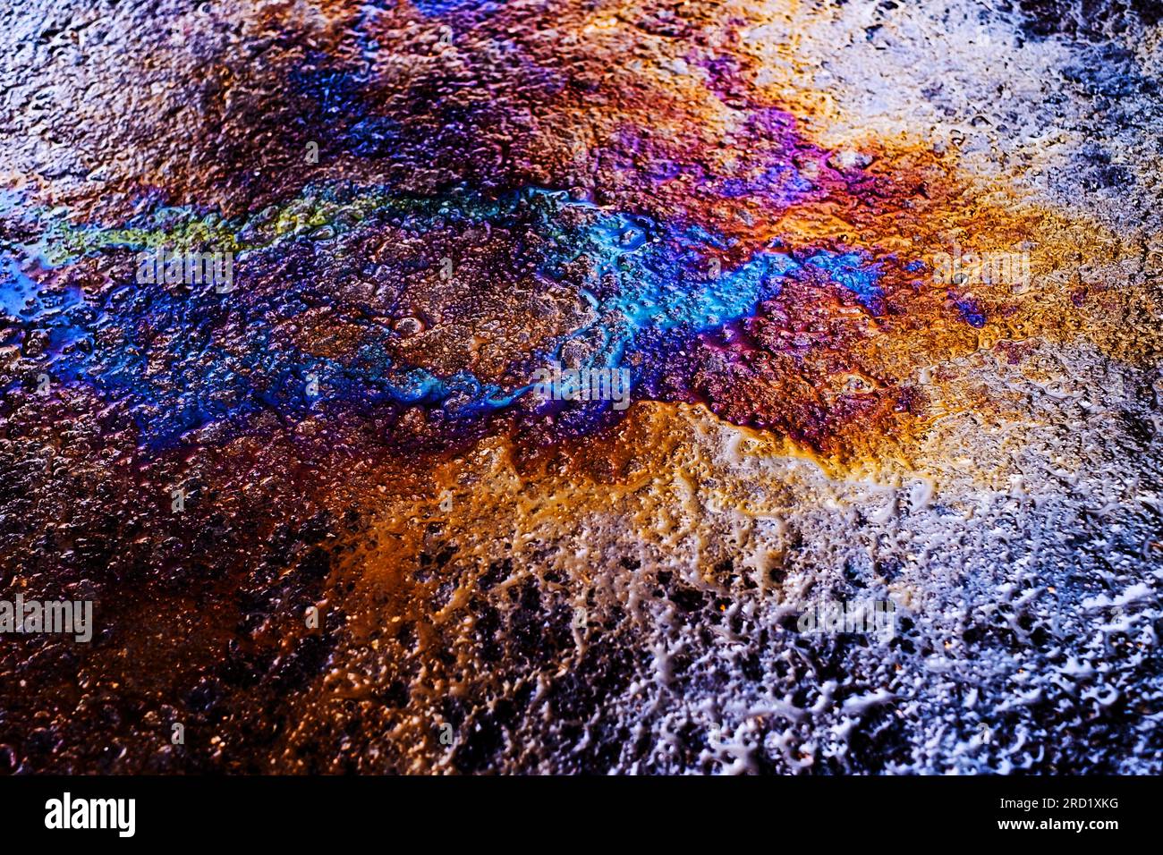 Oil stain on Asphalt road after rain, color Gasoline fuel spots on ...