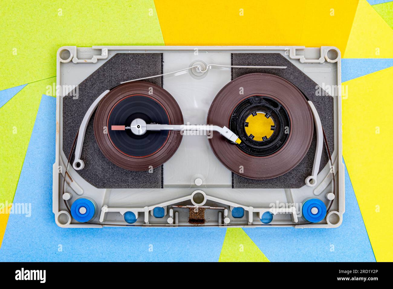 Top view of old vintage retro audio tape cassettes with a turntable arm ...