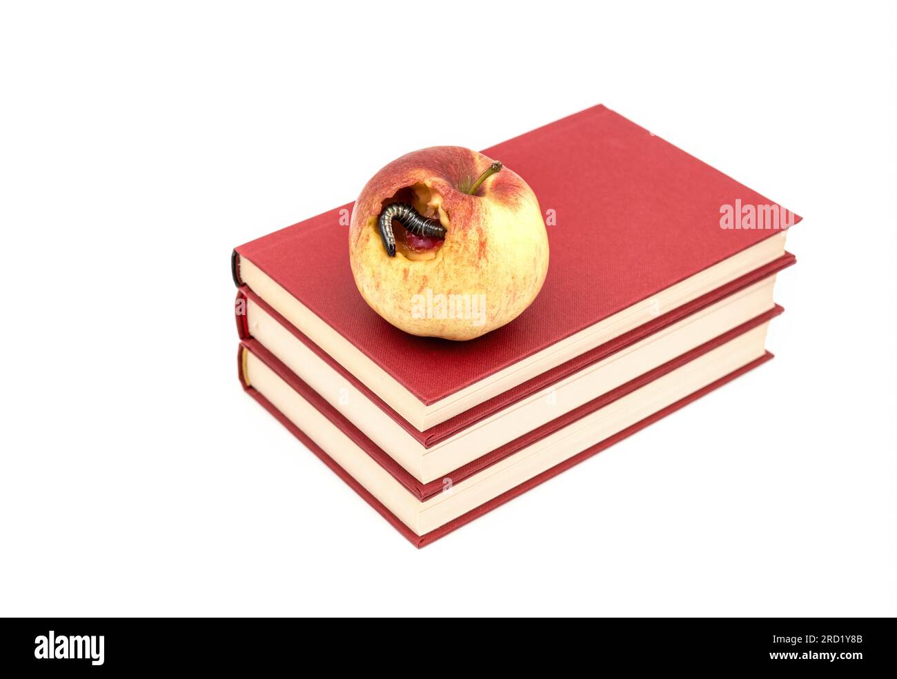 Worm eating Apple on a Stack of Book isolated on white background Stock ...