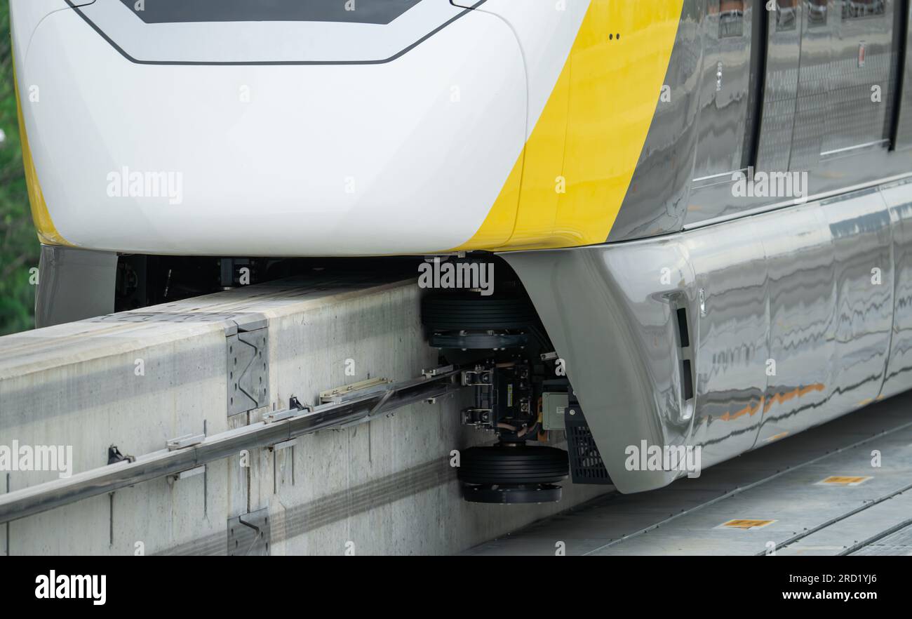 Elevated monorail train on rail. Guide wheels rubber tire on concrete ...