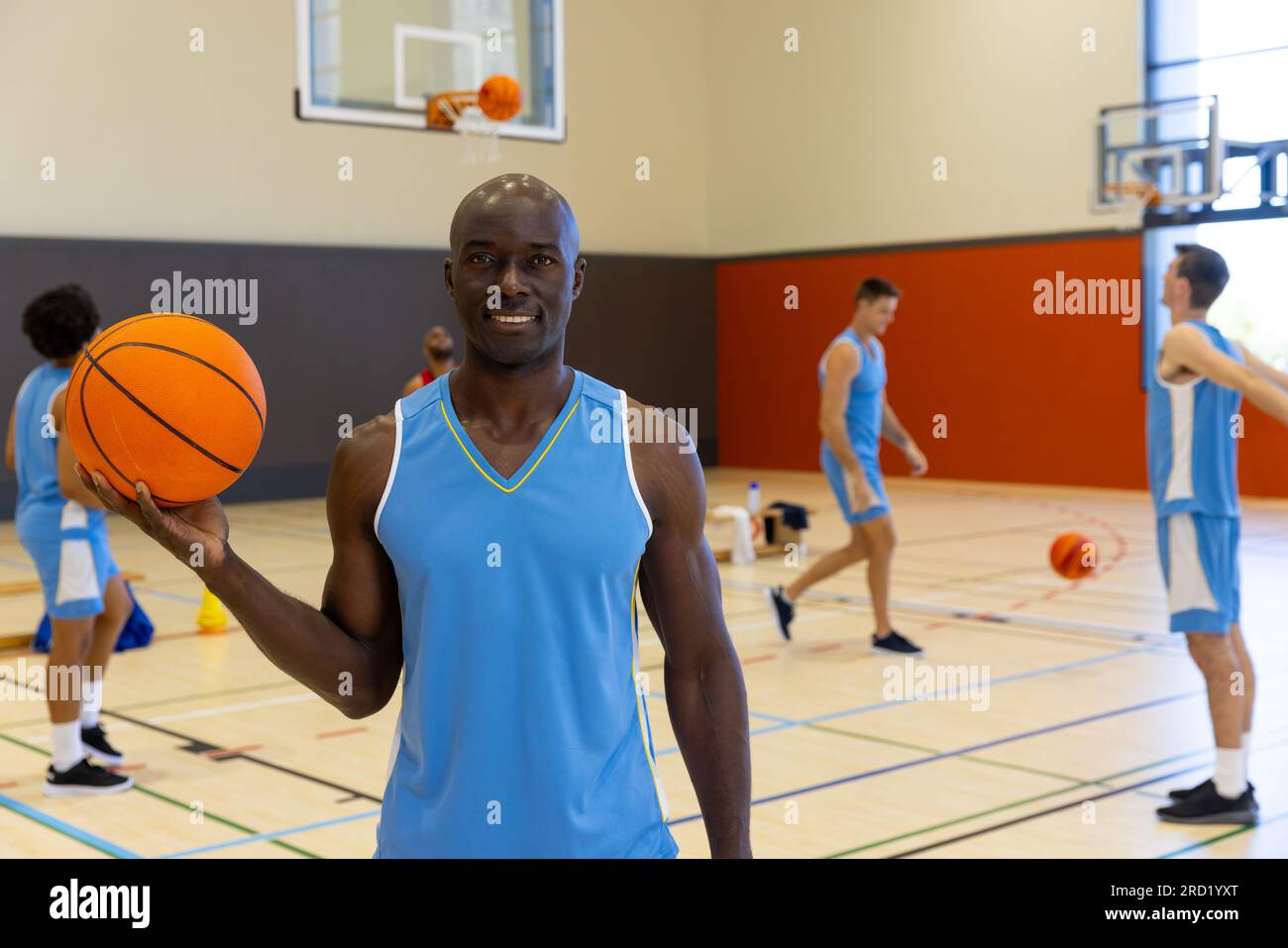 Portrait of happy african american male basketball player with ...