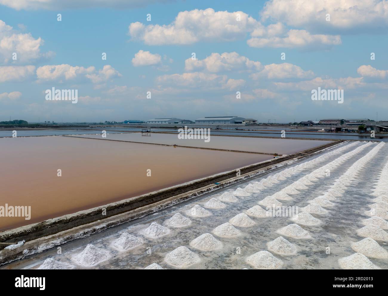 Aerial view of sea salt farm. Pile of brine salt. Raw material of salt ...