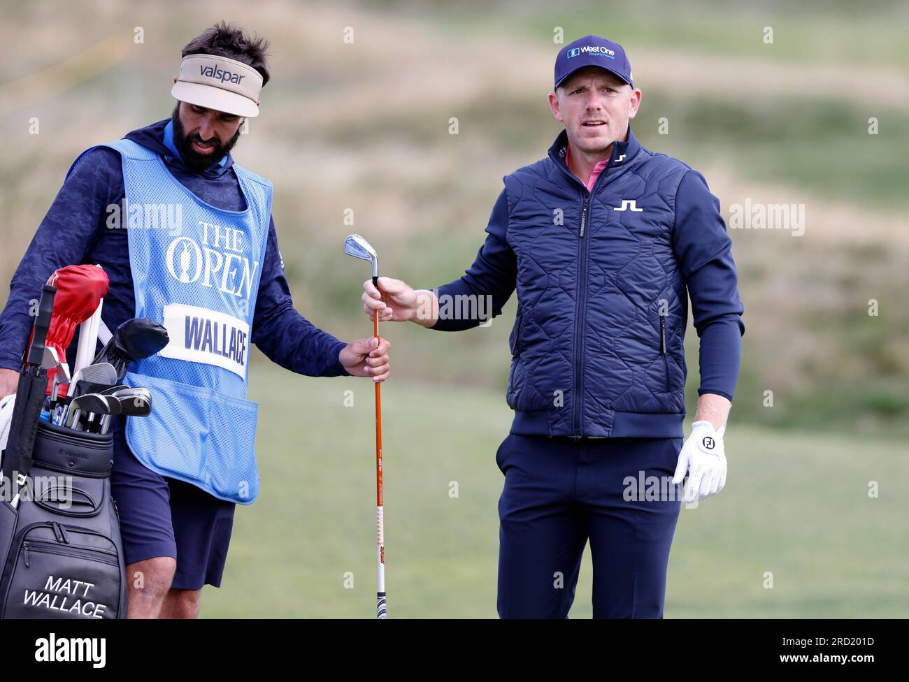 England's Matt Wallace (right) with caddie Sam Bernard plays from the ...