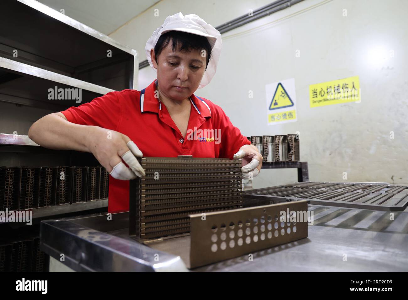 BINZHOU, CHINA - JULY 17, 2023 - A worker produces high-voltage silicon ...
