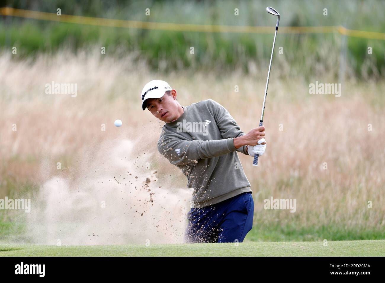 USA's Collin Morikawa chips out of a bunker on the 8th during a ...