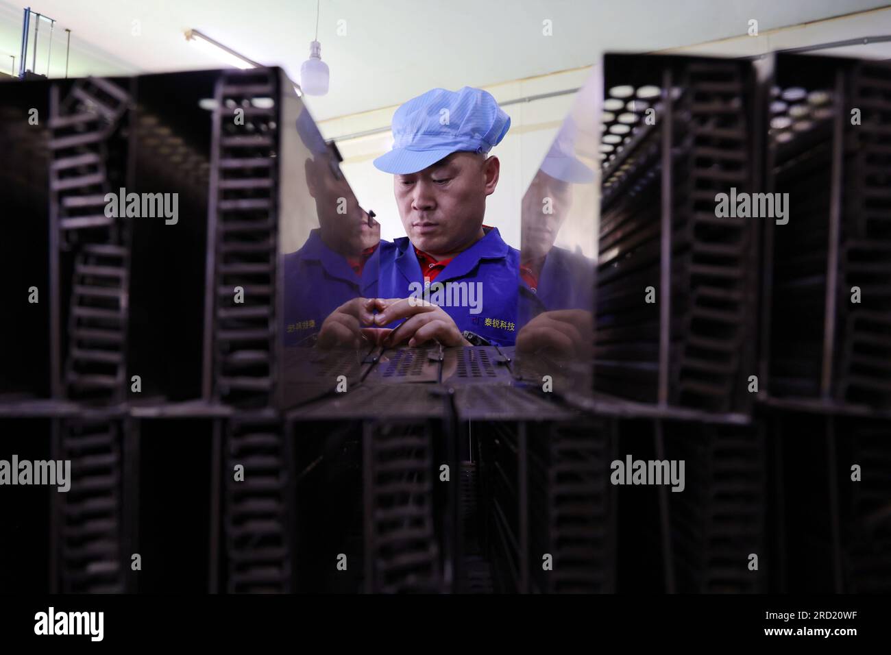 BINZHOU, CHINA - JULY 17, 2023 - A worker produces high-voltage silicon ...