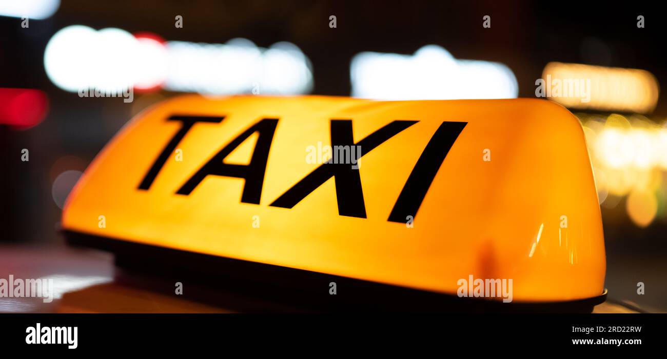 Taxi car light on dark street of night city closeup. Cab sign on the ...