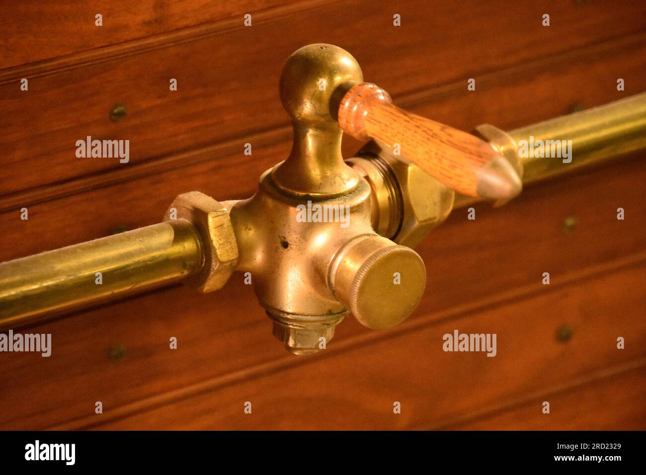 Wooden turn off valve with pass through on copper piping Stock Photo ...