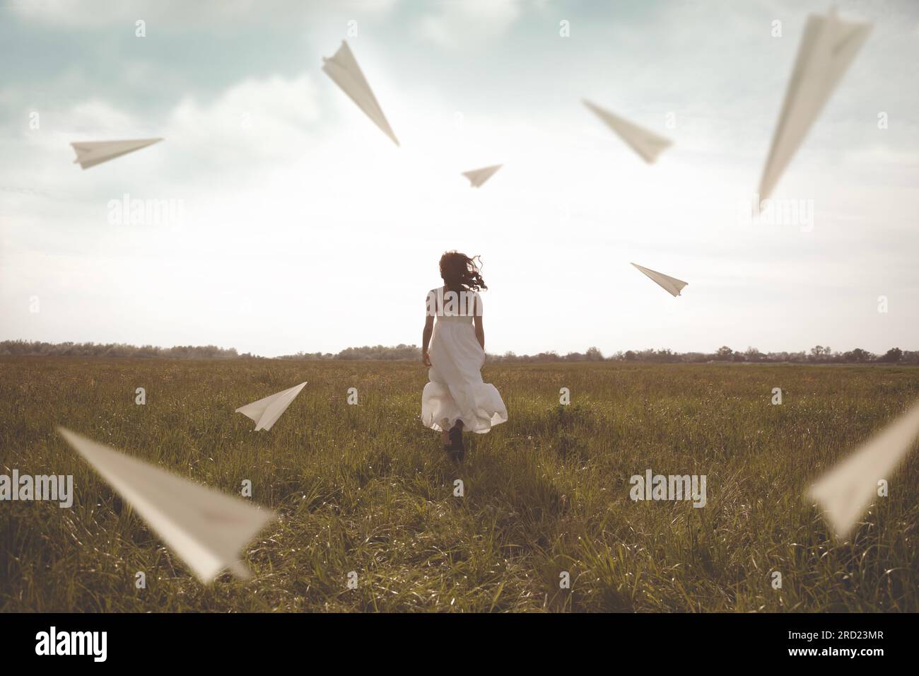 surreal flying of paper airplanes surrounding a woman running in the ...