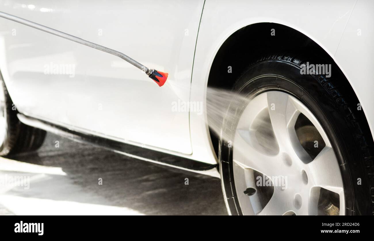 Washing a car in a self-service car wash station with wahing foam. Wash ...