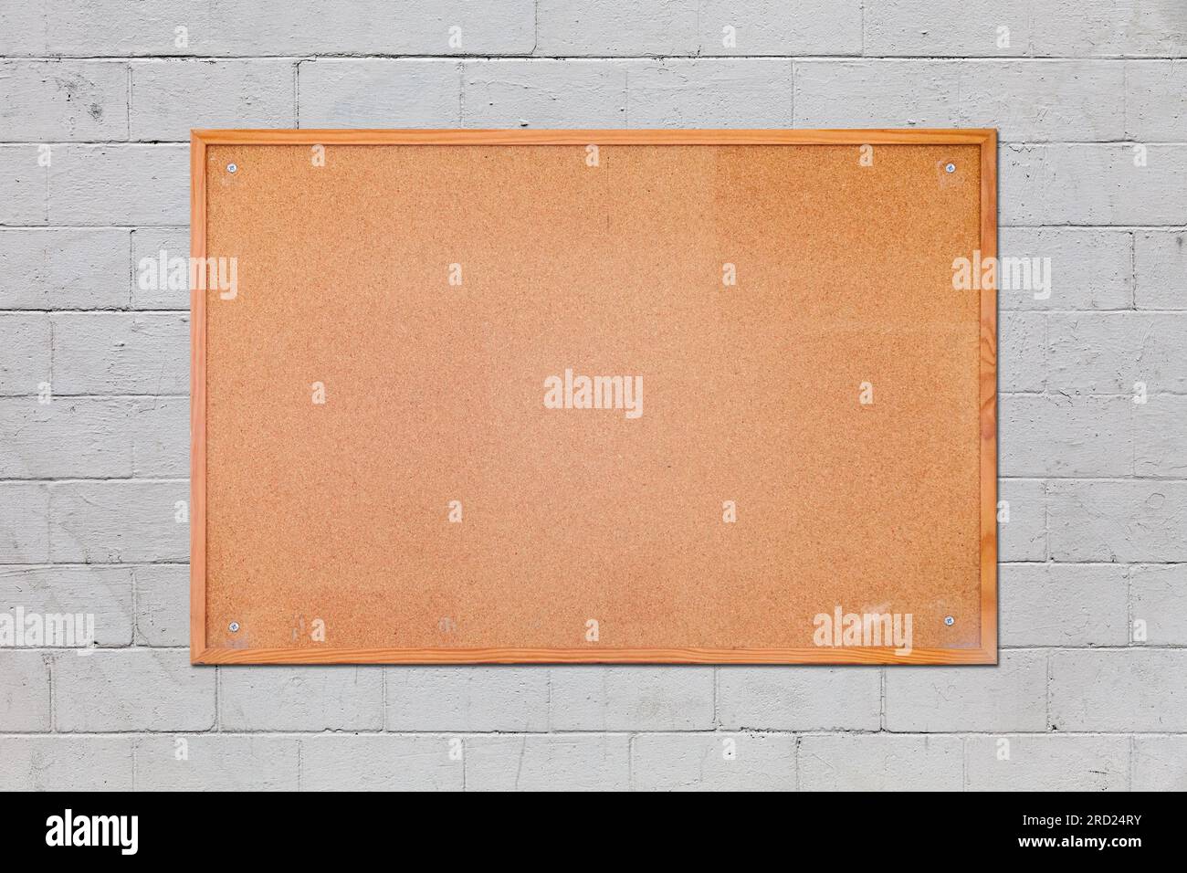 Cork board with copy space on a painted cinder block wall Stock Photo ...