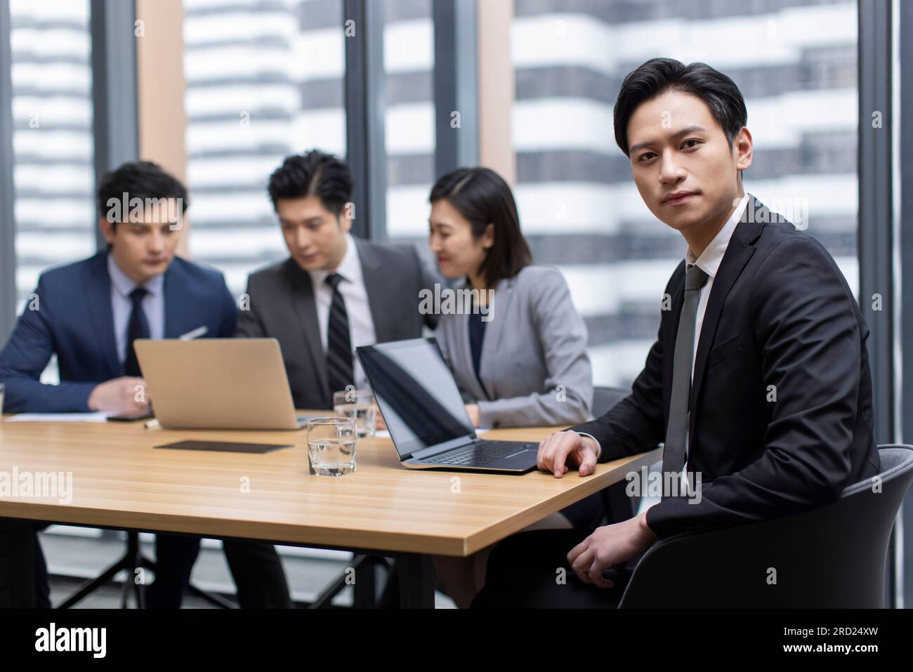 Confident chinese business people having hi-res stock photography and ...