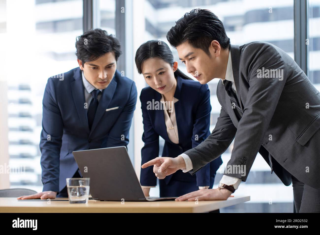 Confident Chinese business people having a meeting Stock Photo - Alamy