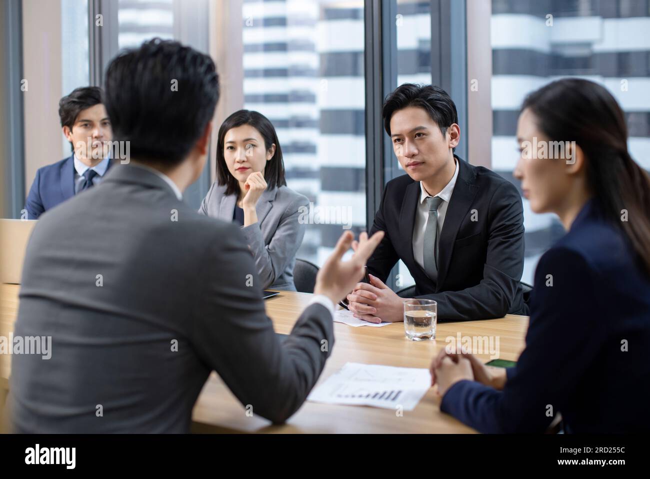 Confident Chinese business people having a meeting Stock Photo - Alamy