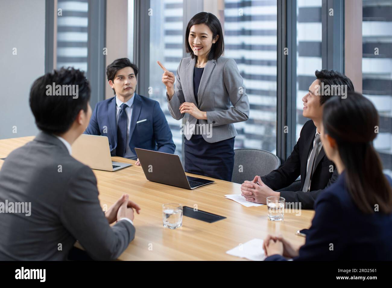 Authority sitting communication pointing face to face hi-res stock ...
