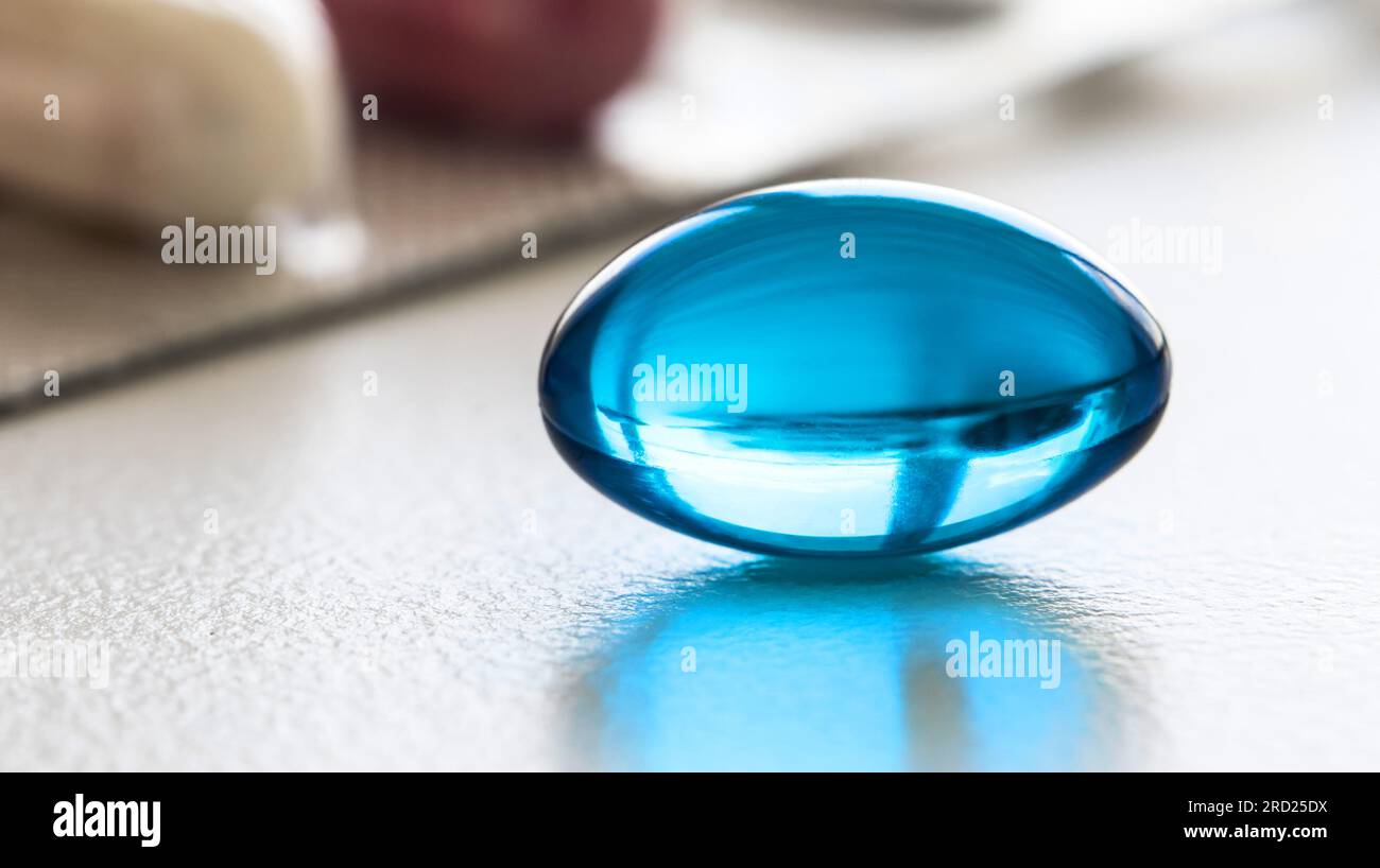 Blue pill drug medicine for desease treatment closeup on blurred ...
