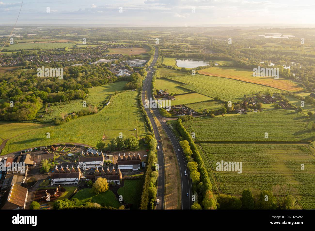 Aerial view of the A228 road cuttiing through fields in the Kent ...