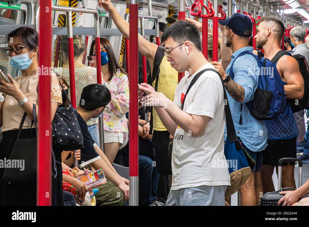 Passengers on MTR rapid transit train, Hong Kong, SAR, China Stock Photo - Alamy