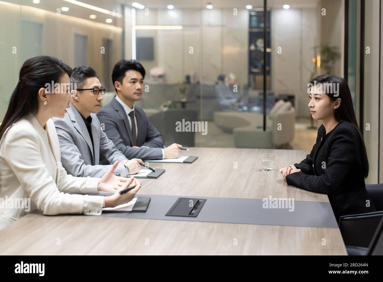 Confident Chinese businesswoman attending job interview Stock Photo - Alamy