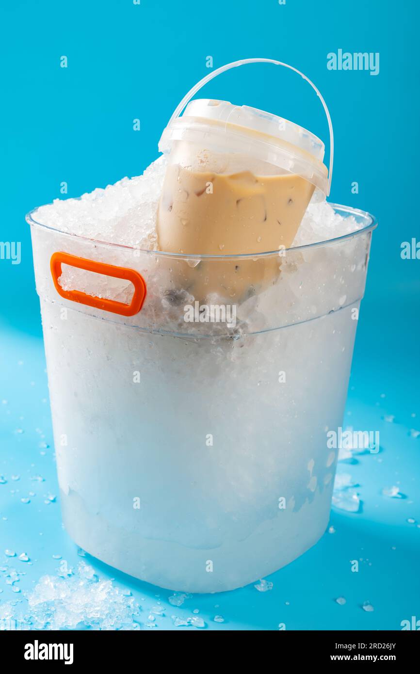 barrel of milktea with tapiocas in an iced bucket at vertical ...