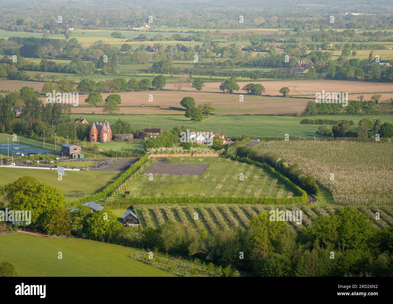 Aerial view of a farm and surrounding fields in the countryside in Kent ...