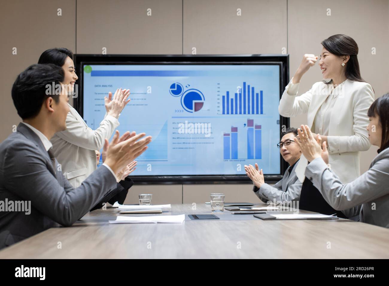 Business people standing side applauding hi-res stock photography and ...
