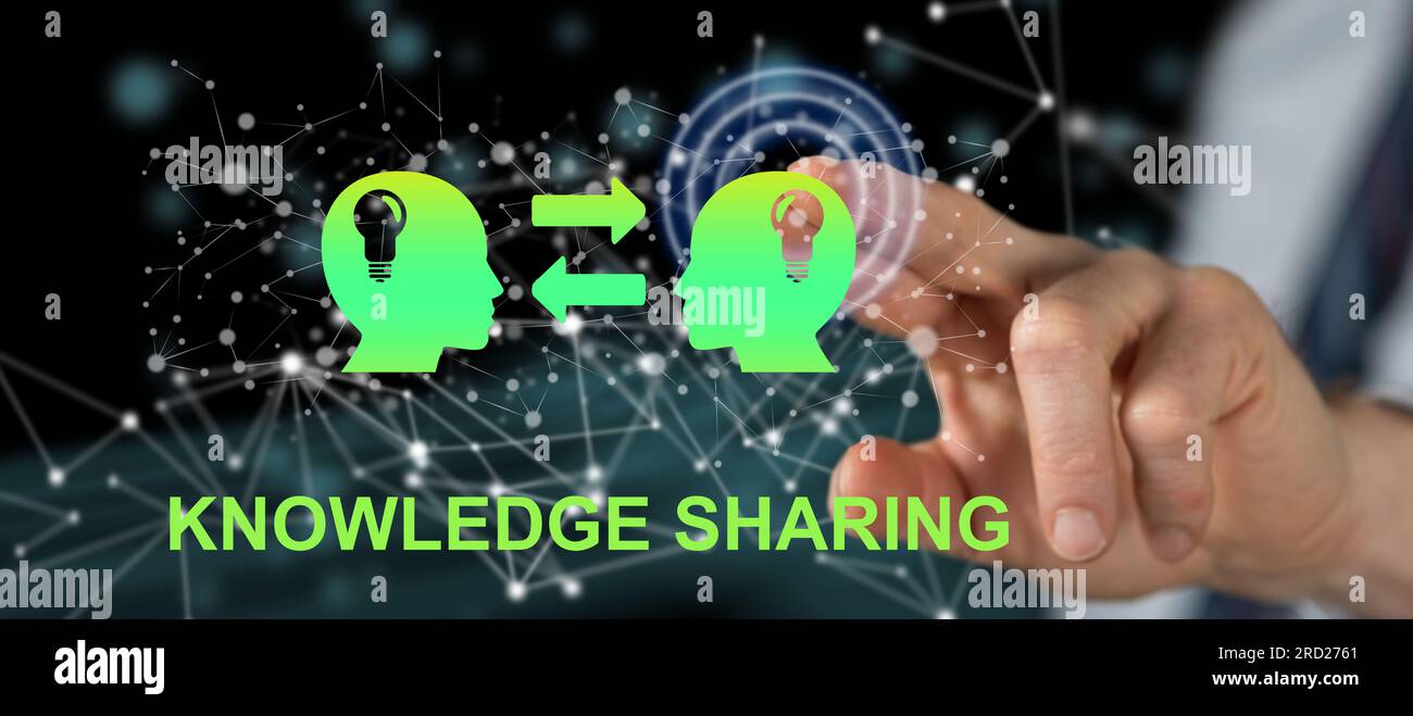 Man touching a knowledge sharing concept on a touch screen with his ...