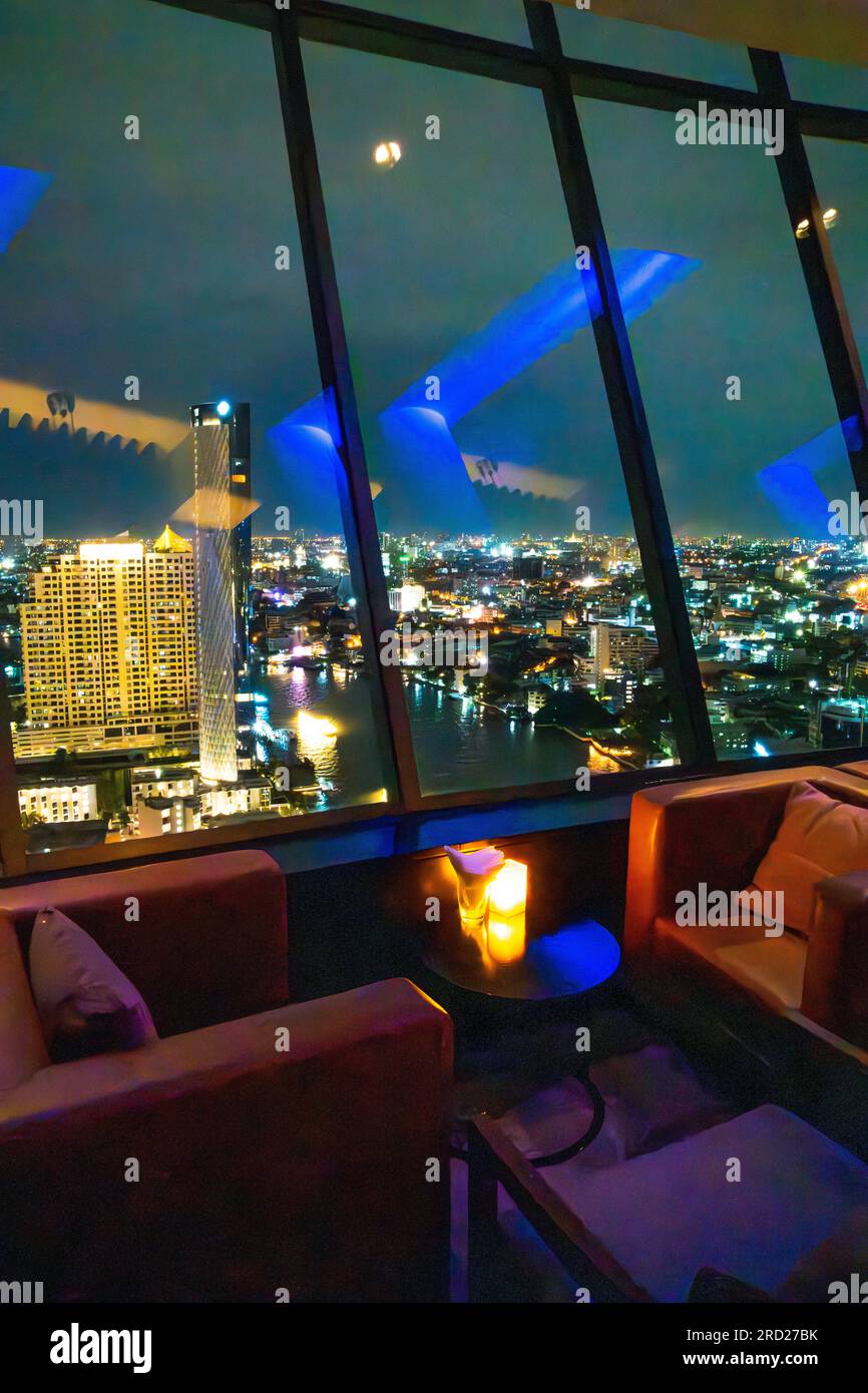 Cocktail in a jazz lounge bar with the view on Chao Phraya river in ...