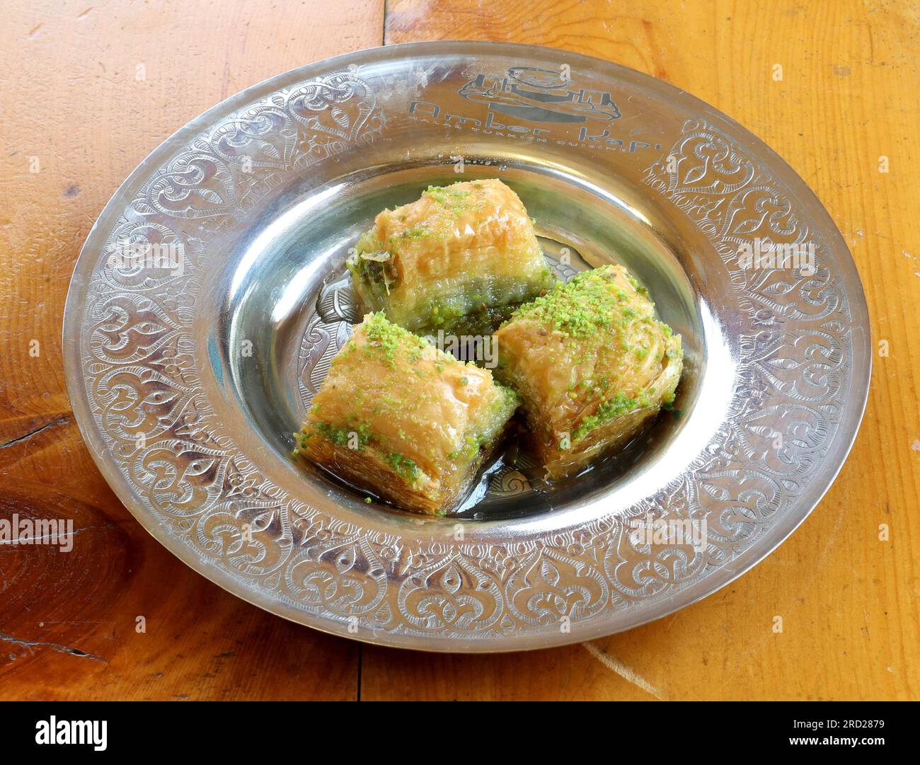 A dish of baklava, a layered pastry dessert made of pistachio is ...