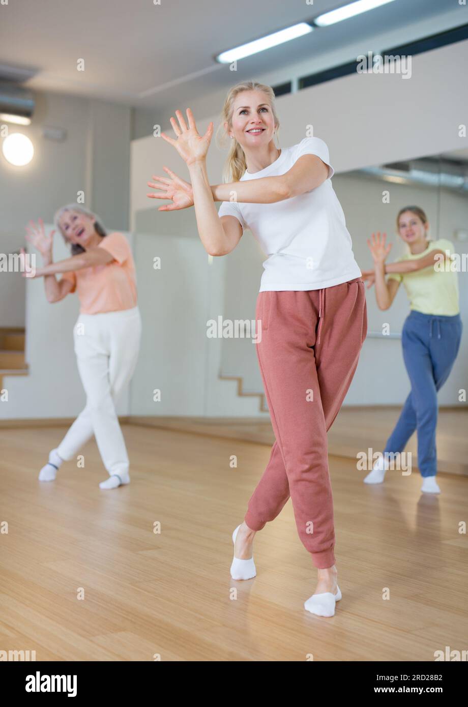 Modern active females dancing excited posing in studio Stock Photo - Alamy