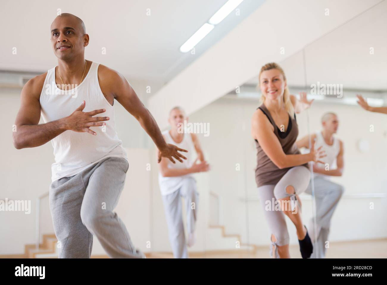 Man dancing at group lesson in studio Stock Photo - Alamy