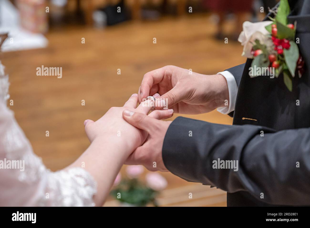 wedding rings and hands of bride and groom ring exchange couple at ...