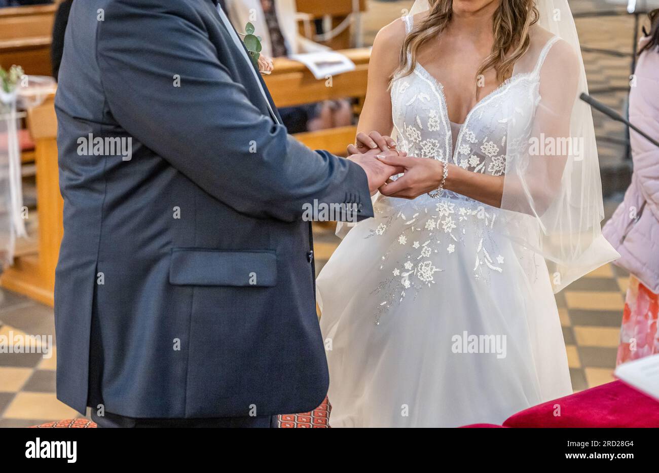 wedding rings and hands of bride and groom ring exchange couple at ...
