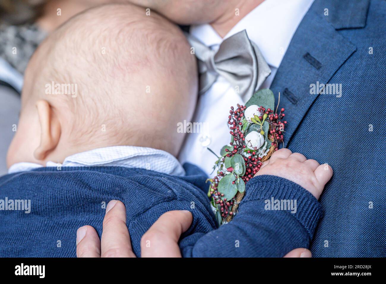 Close up of child hand holding groom body on wedding Stock Photo - Alamy