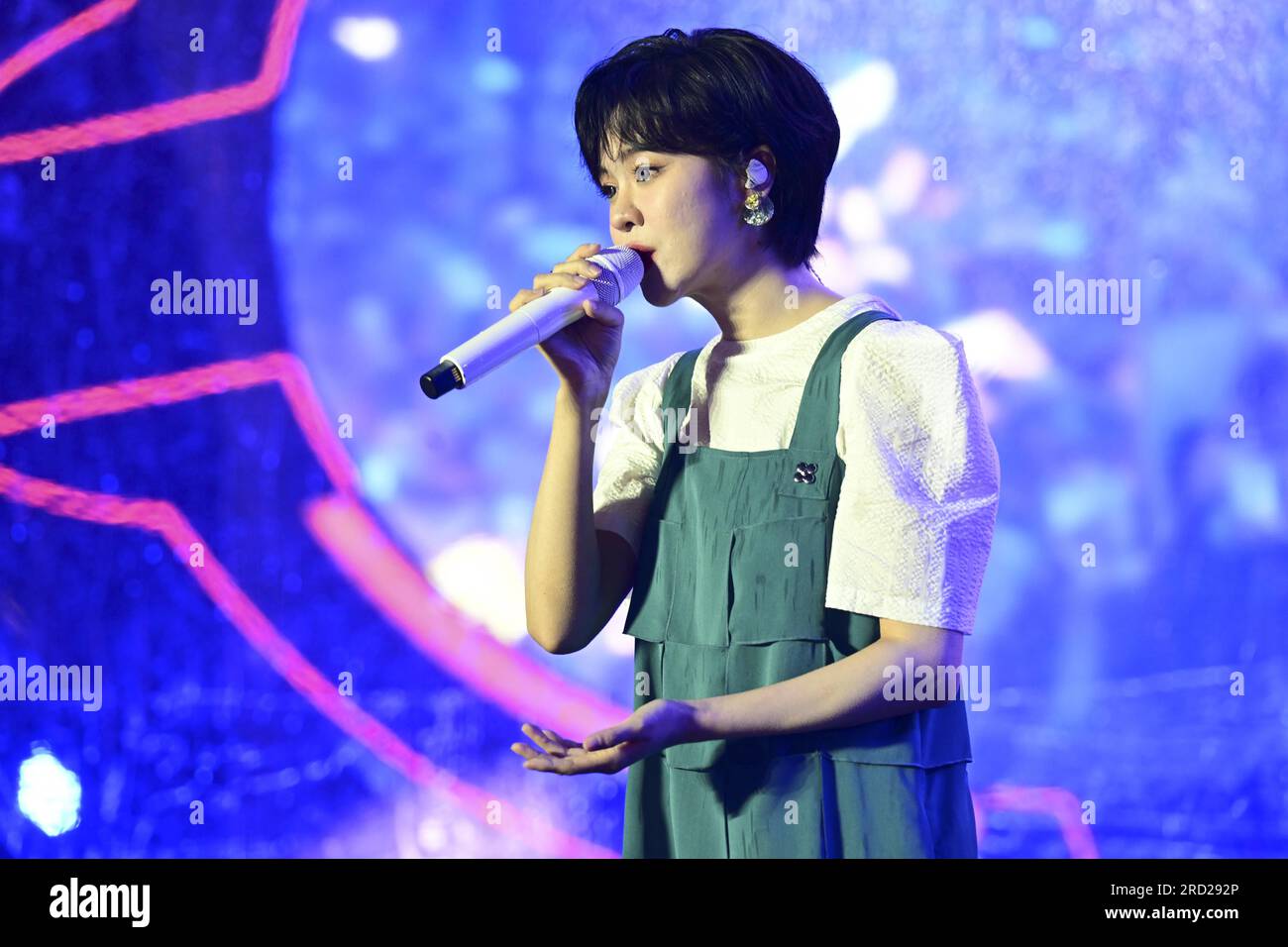Chinese singer Yisa Yu performs at a beer music festival in Suzhou City ...