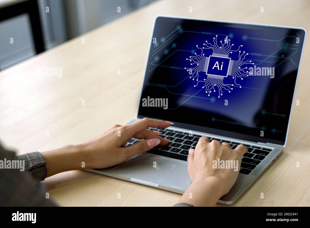Business woman is entering data on her laptop computer, which ...