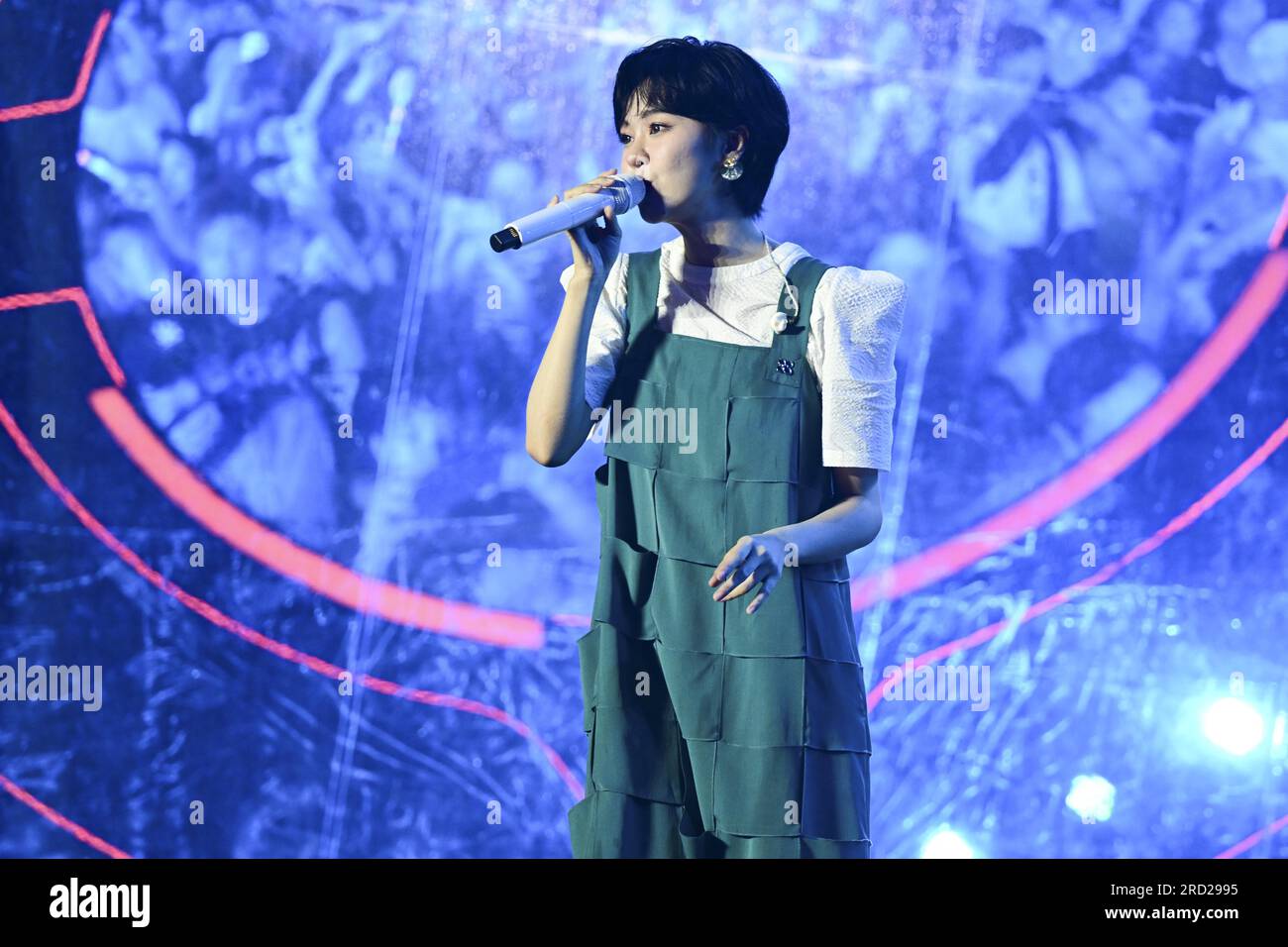 Chinese singer Yisa Yu performs at a beer music festival in Suzhou City ...