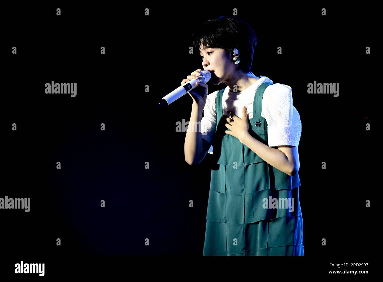 Chinese singer Yisa Yu performs at a beer music festival in Suzhou City ...