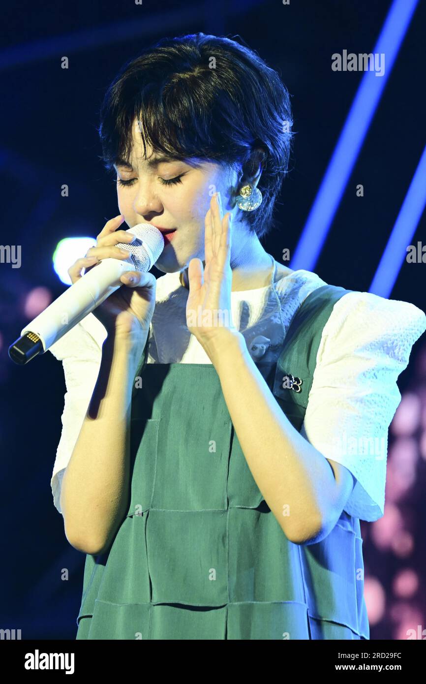 Chinese singer Yisa Yu performs at a beer music festival in Suzhou City, east China's Jiangsu ...